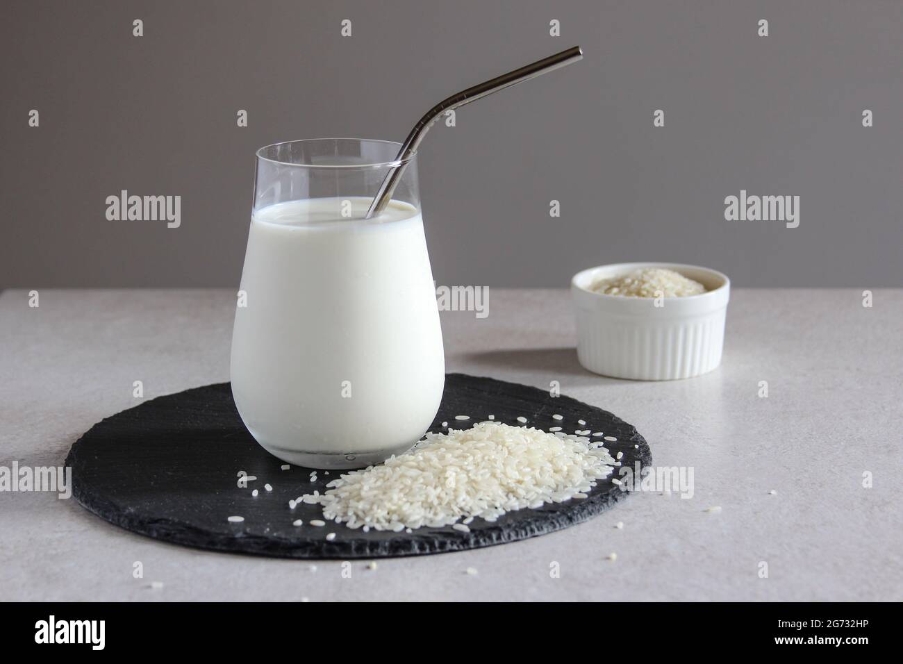 Vegan milk from rice grains on the table. Vegan or vegetables milk ...
