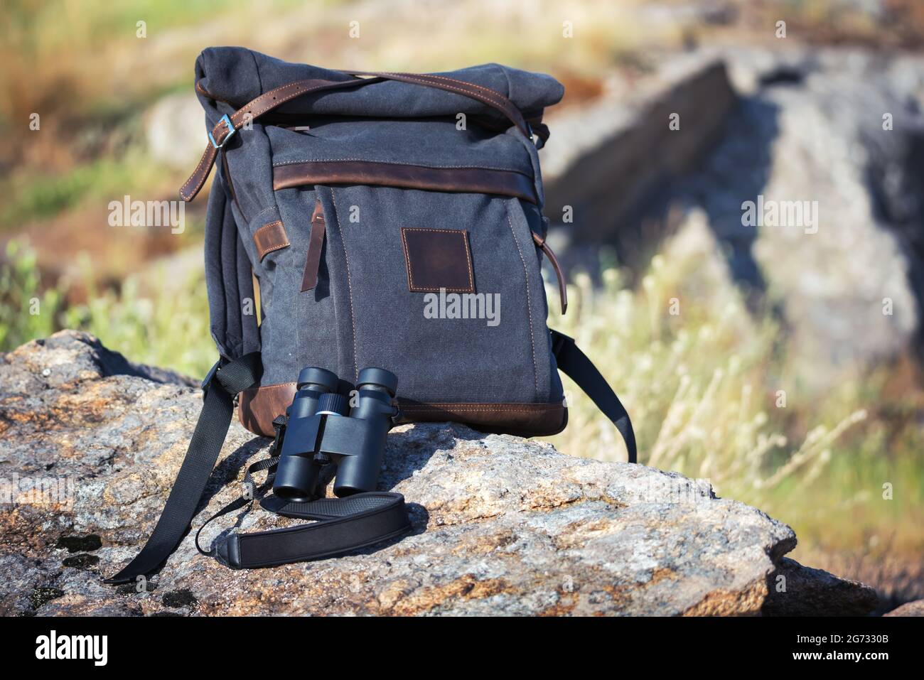 The set for birdwatcher with dark gray backpack and binoculars for ...