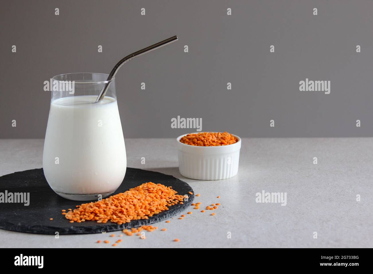 Vegan milk from lentils grains on the table. Vegan or vegetables milk ...