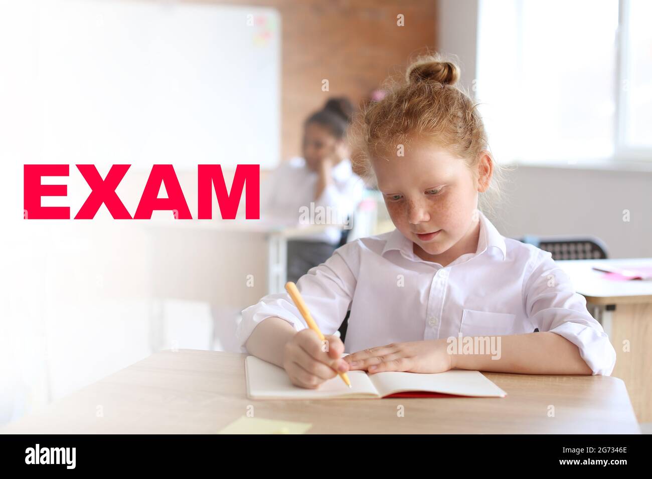 Little girl passing exam at school Stock Photo - Alamy