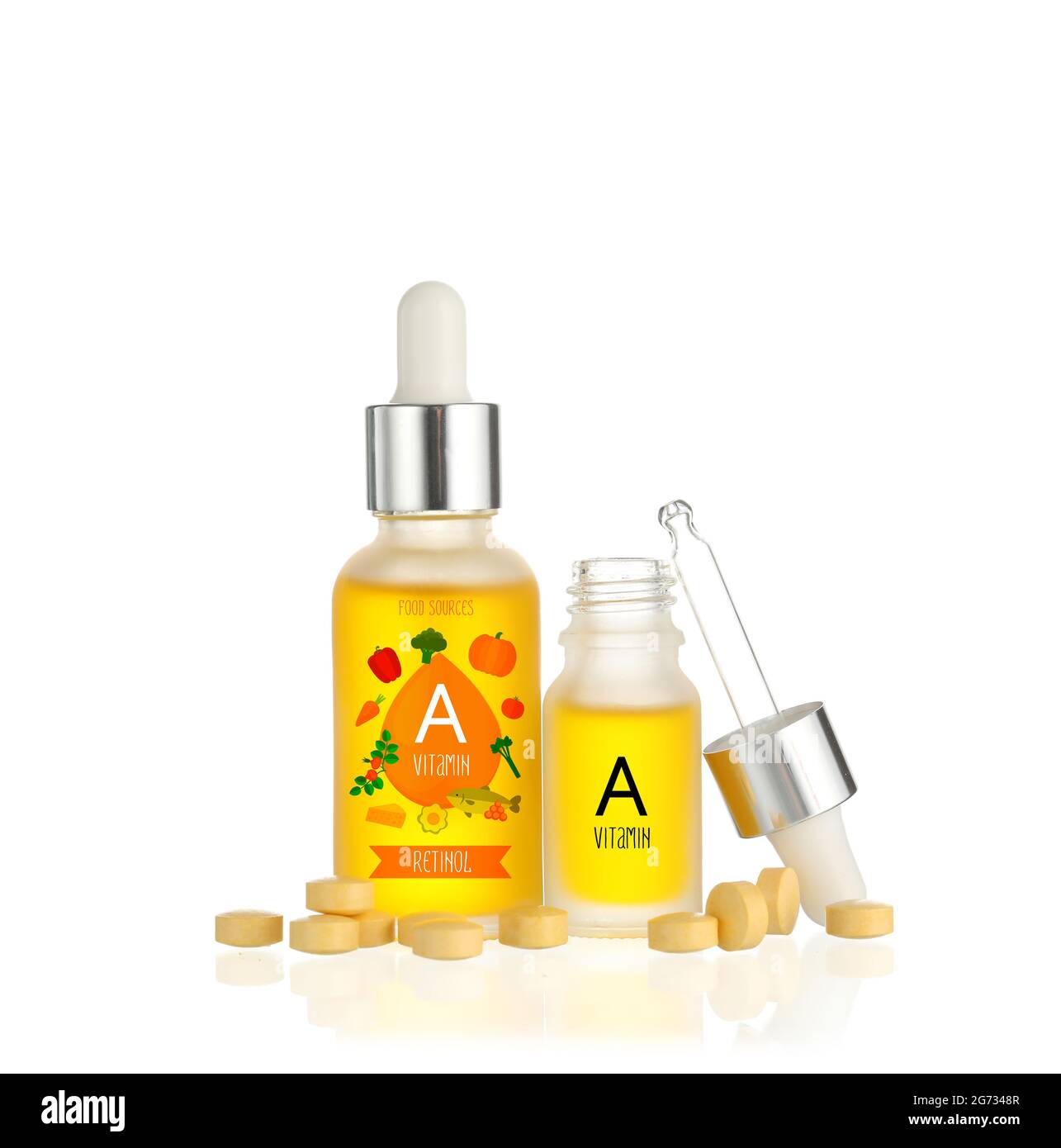 Bottles of vitamin A oil and pills on white background Stock Photo - Alamy