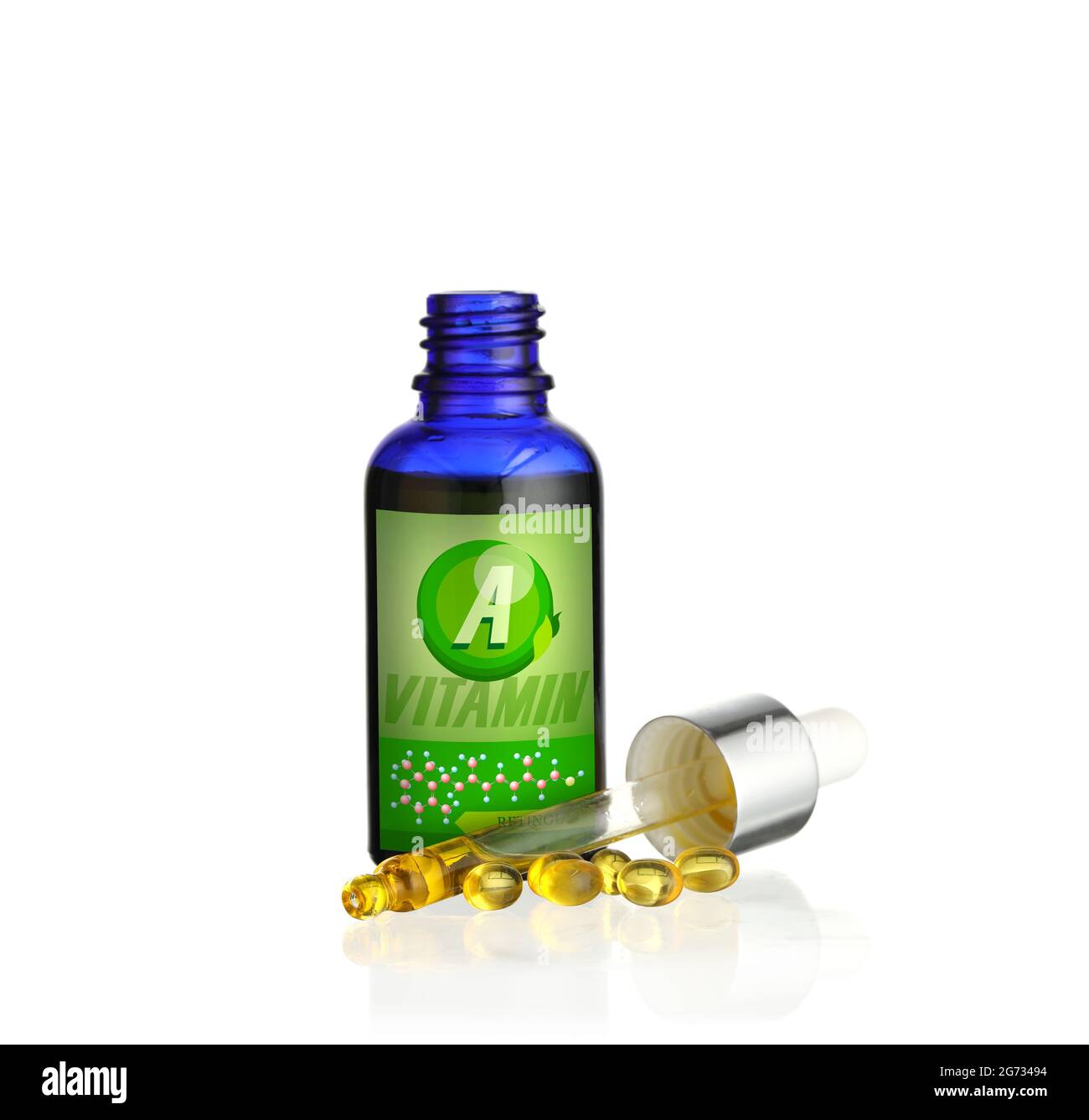 Bottle of vitamin A oil and pills on white background Stock Photo - Alamy
