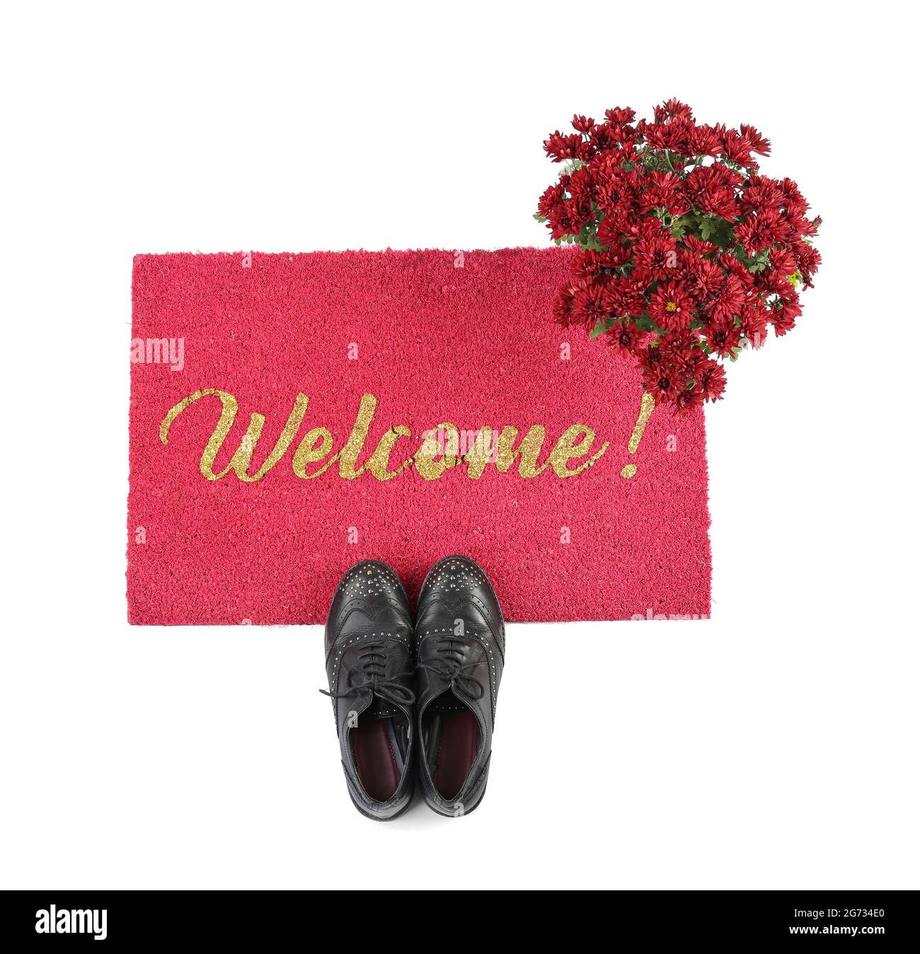 Doormat with shoes on white background Stock Photo - Alamy