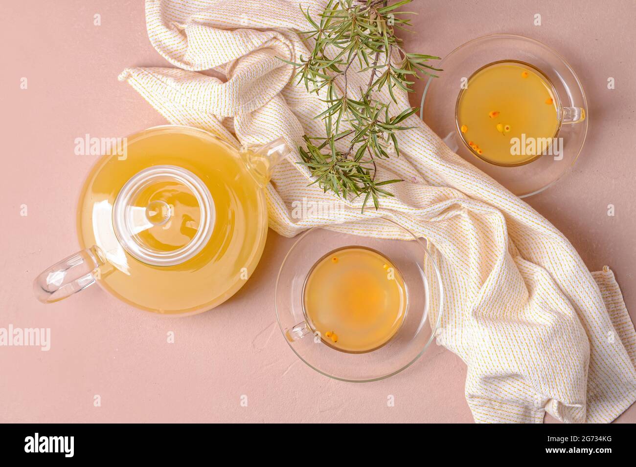 Healthy sea buckthorn tea on color background Stock Photo - Alamy