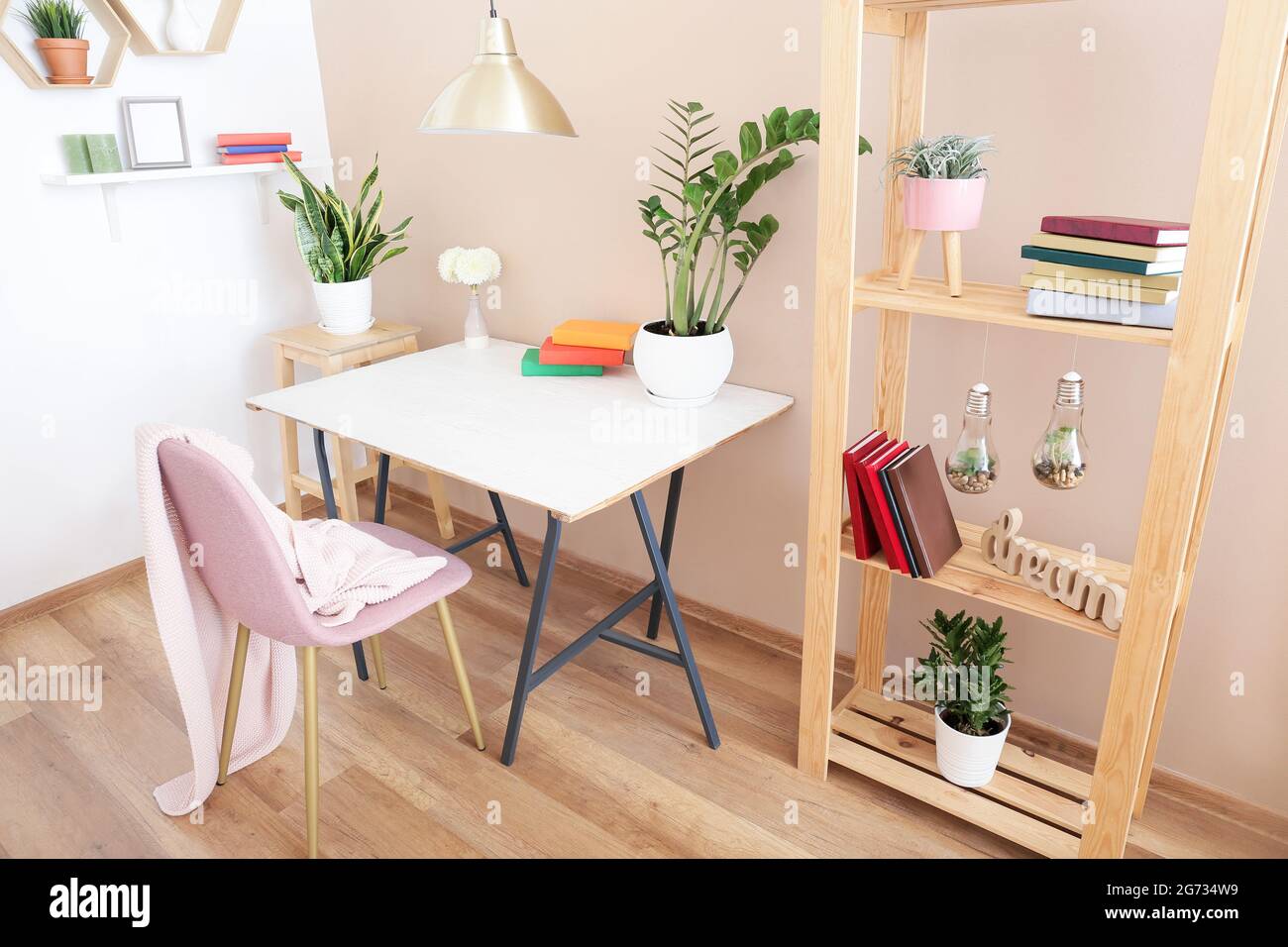 Interior of modern room with shelf unit and table Stock Photo - Alamy