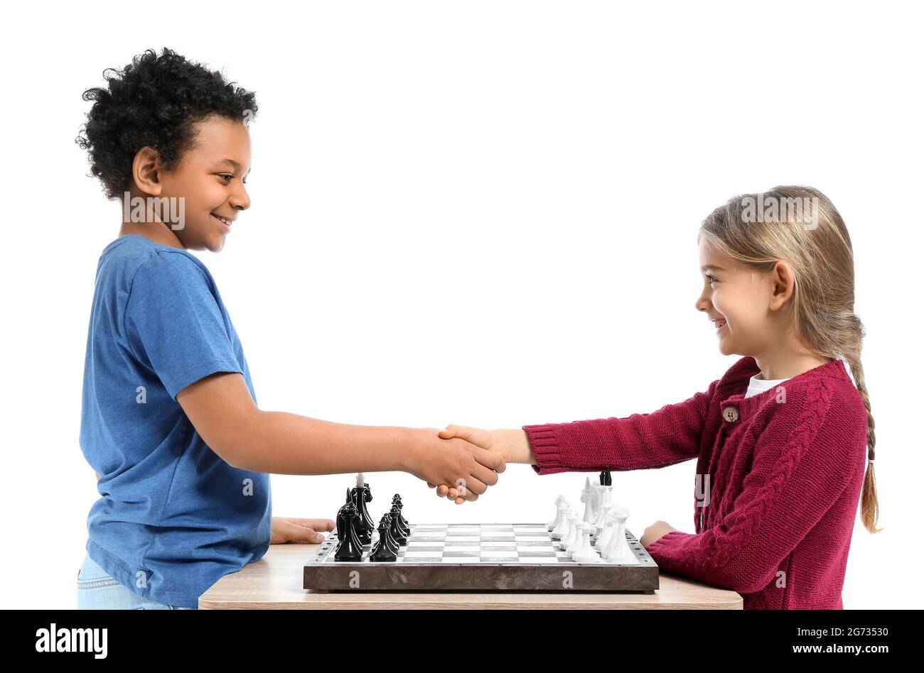 Cute little children playing chess on white background Stock Photo - Alamy