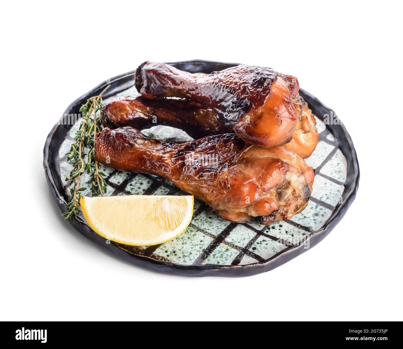 Plate with roasted chicken legs on white background Stock Photo - Alamy