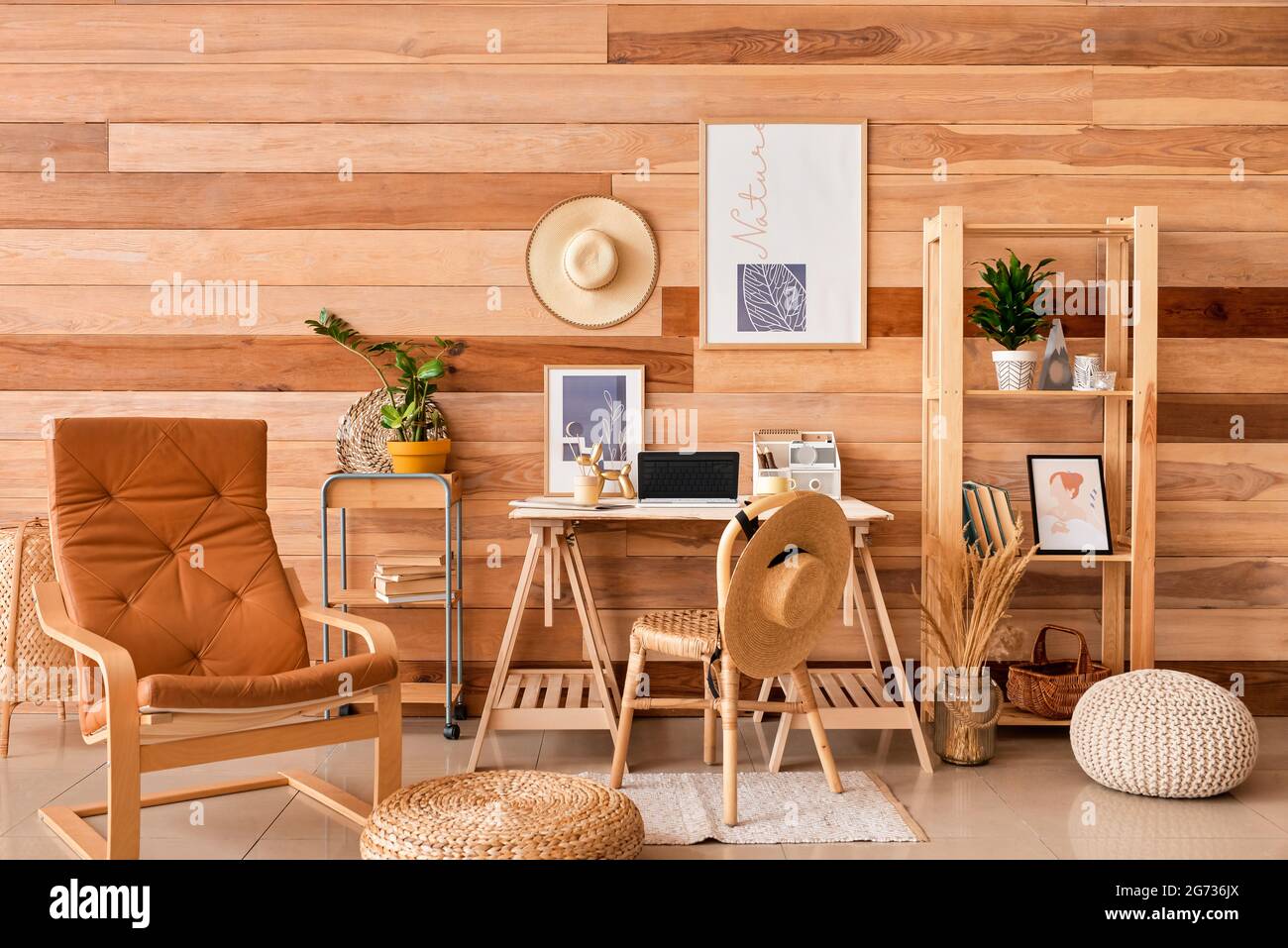 Interior of stylish room with modern workplace and pictures Stock Photo ...