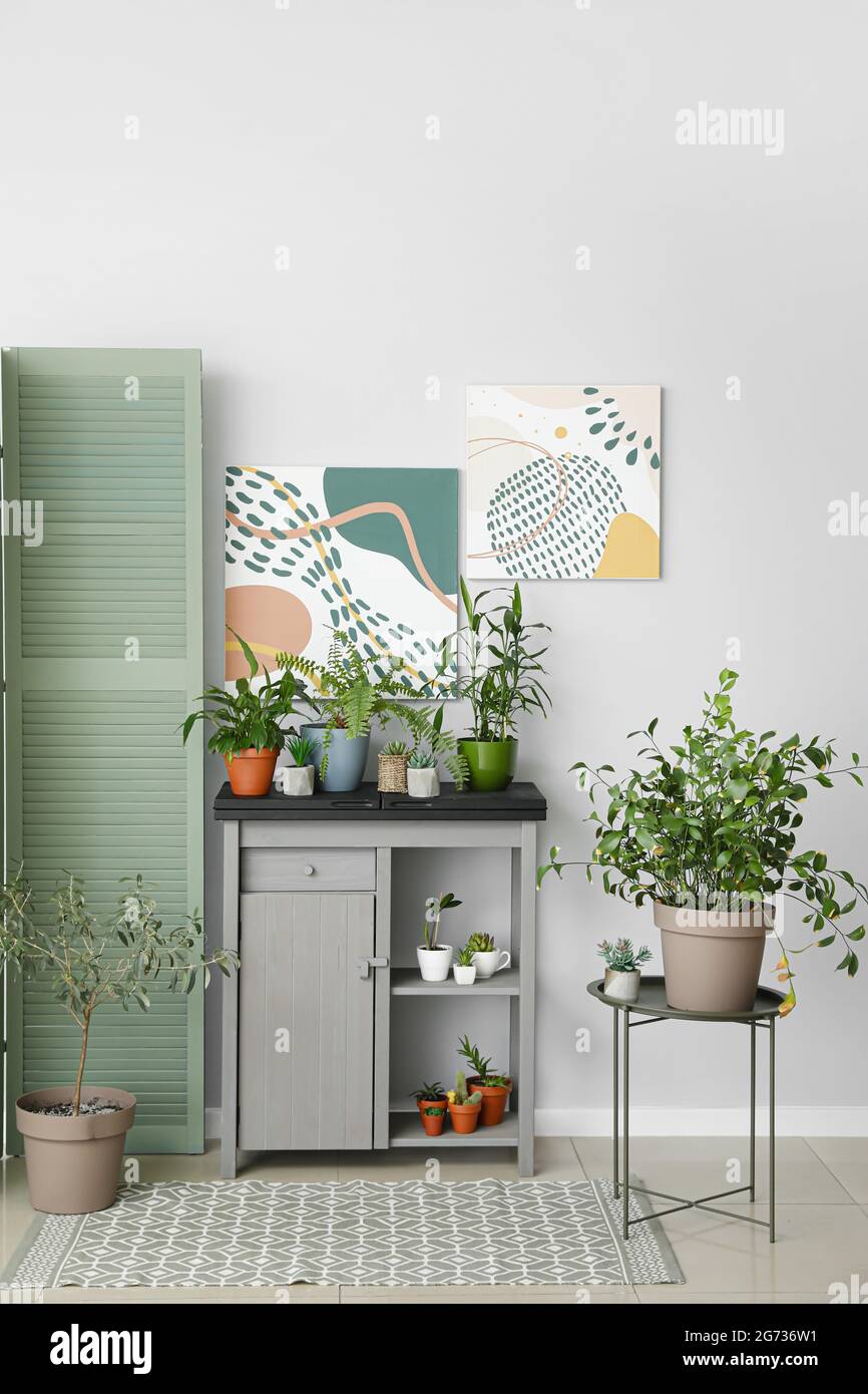 Interior of stylish room with folding screen Stock Photo - Alamy