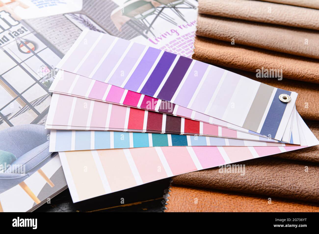Paint color palettes with fabric samples and magazine, closeup Stock ...