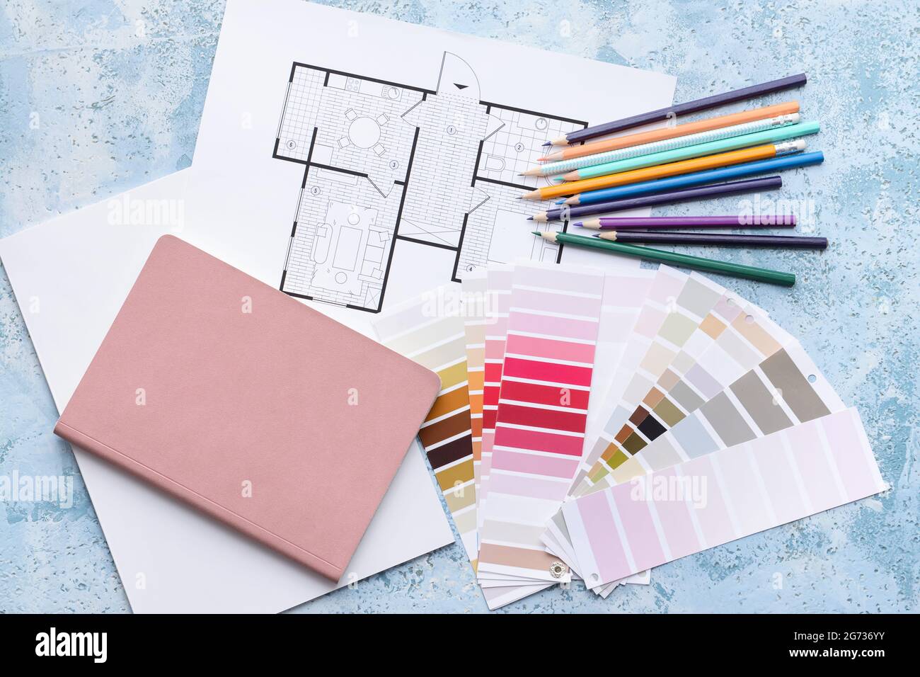 Composition with paint color samples and house plan on color background ...
