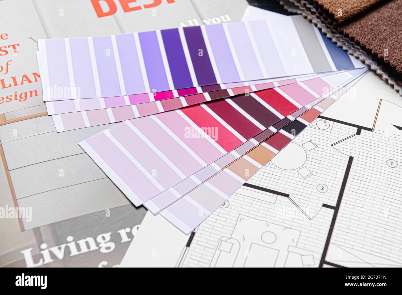 Paint color palettes and house plan on magazine, closeup Stock Photo ...