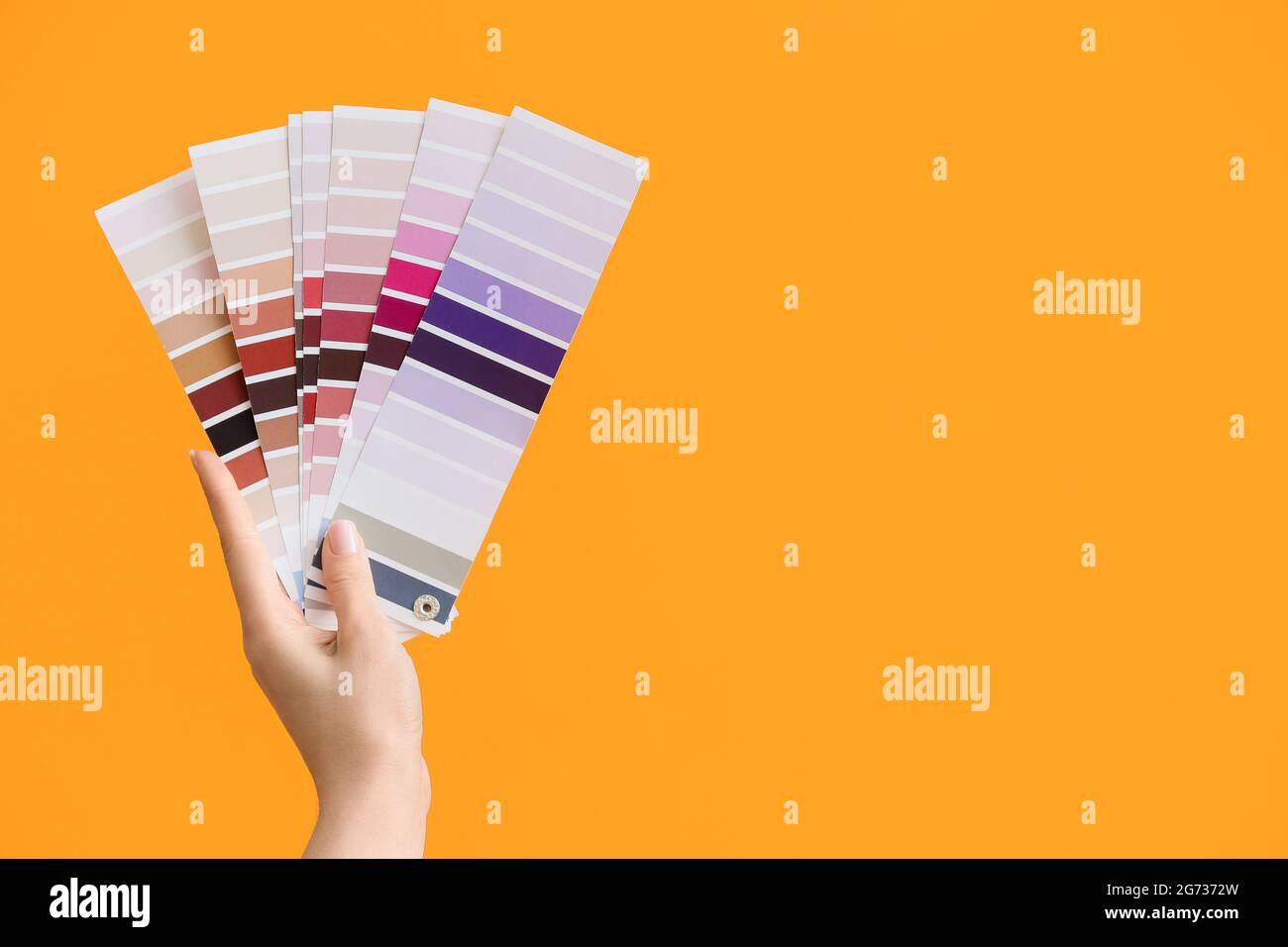 Female hand and paint color palettes on color background Stock Photo ...