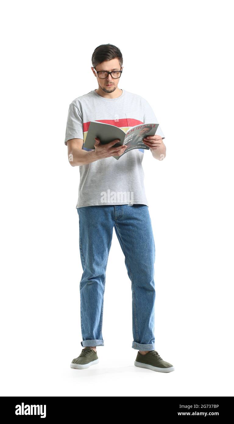 Handsome man reading magazine on white background Stock Photo - Alamy