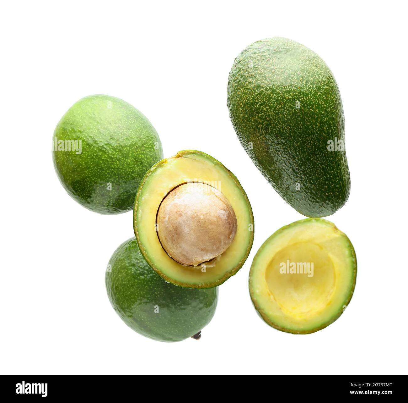 Flying avocados on white background Stock Photo - Alamy