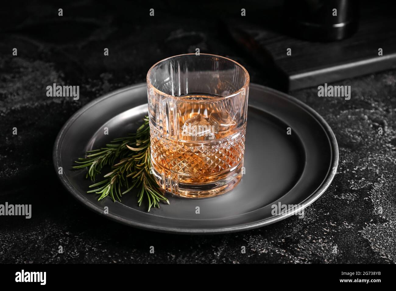 Glass of cold whiskey on dark background Stock Photo - Alamy