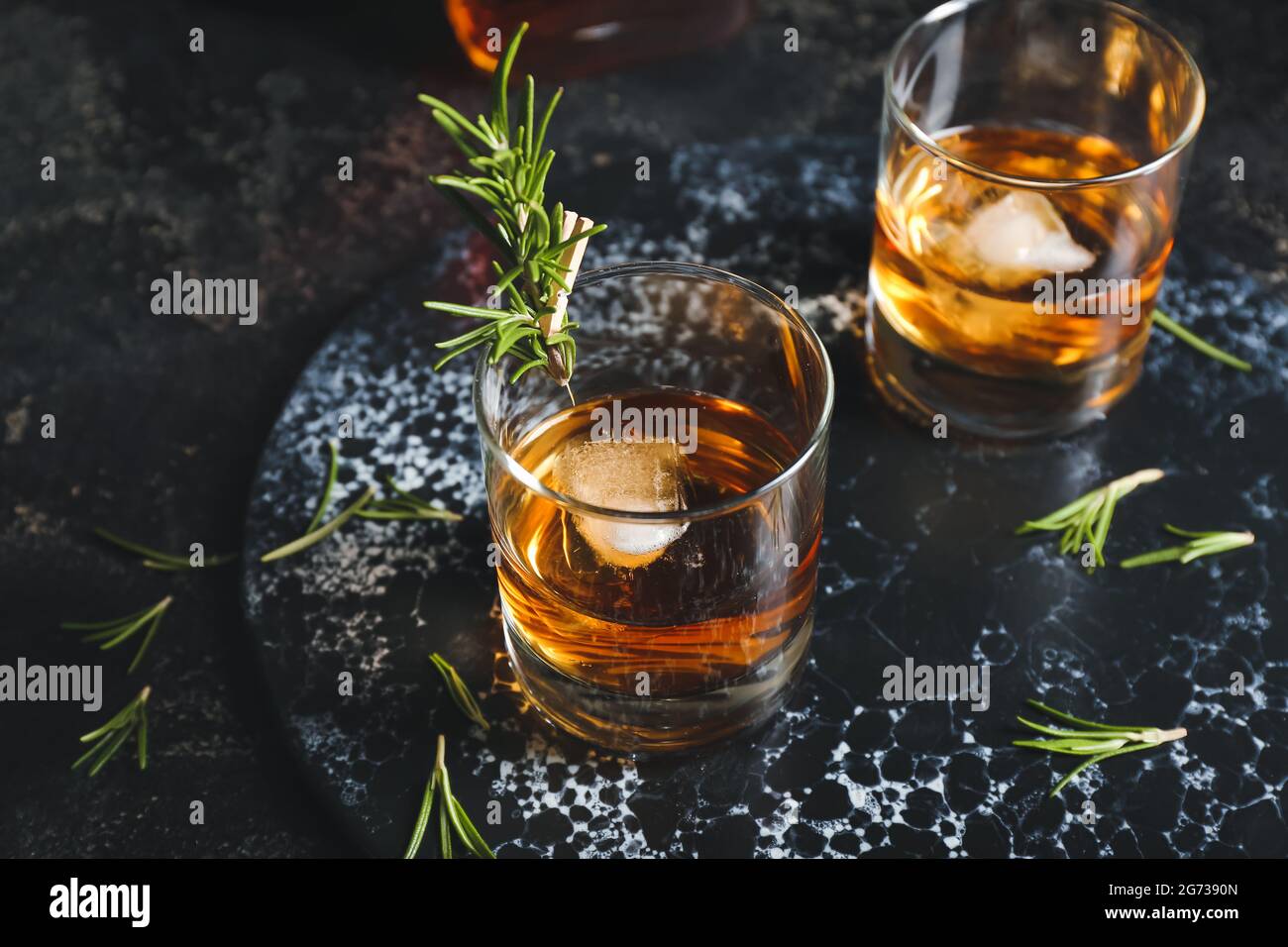 Glasses of cold whiskey on dark background Stock Photo - Alamy
