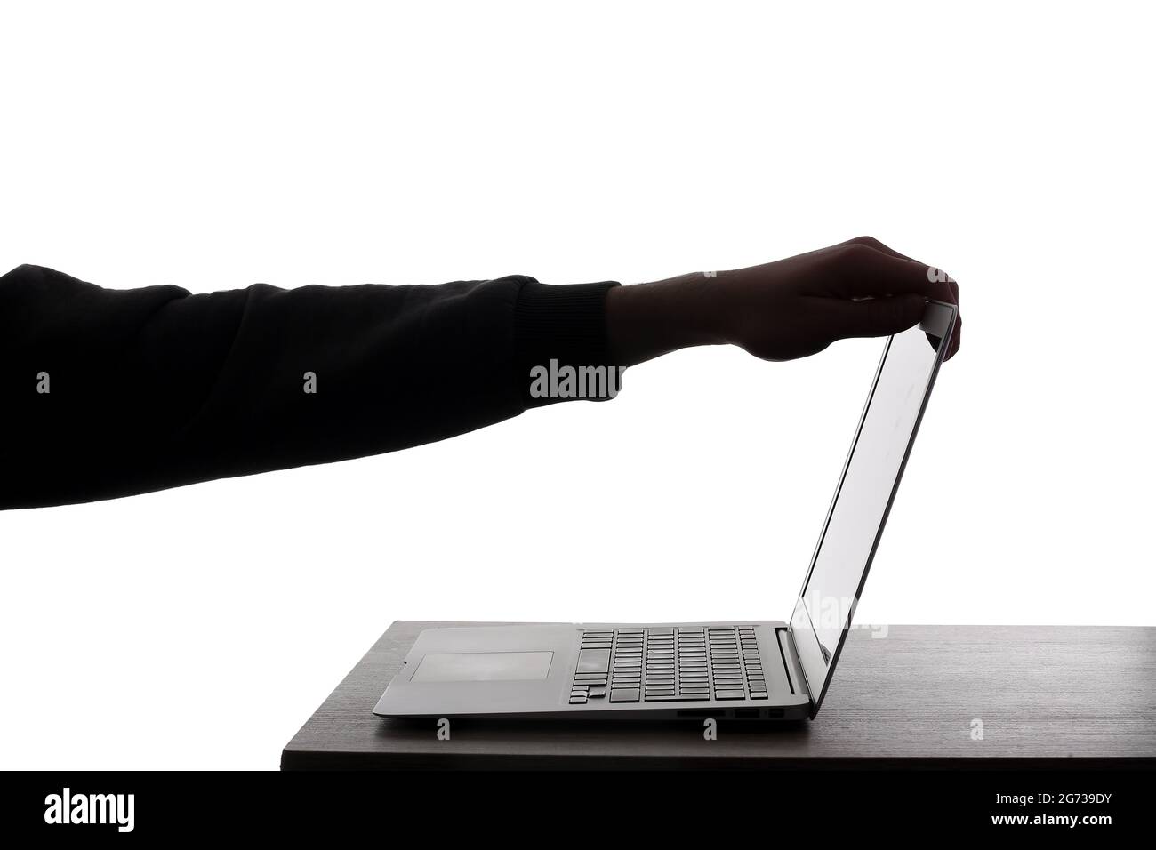 Silhouette of hacker's hand and laptop on white background Stock Photo ...