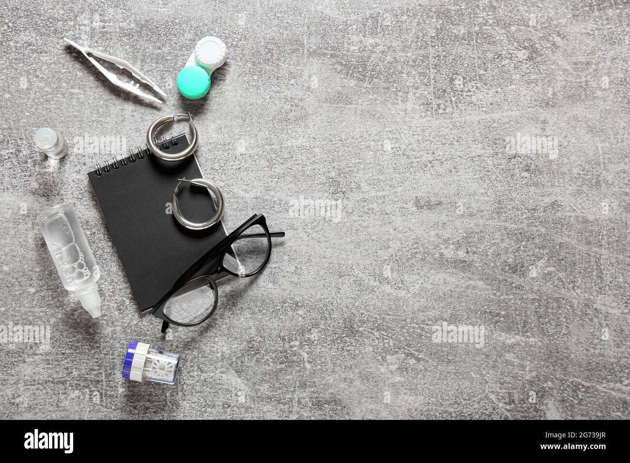 Composition with eyeglasses and contact lenses on grunge background ...