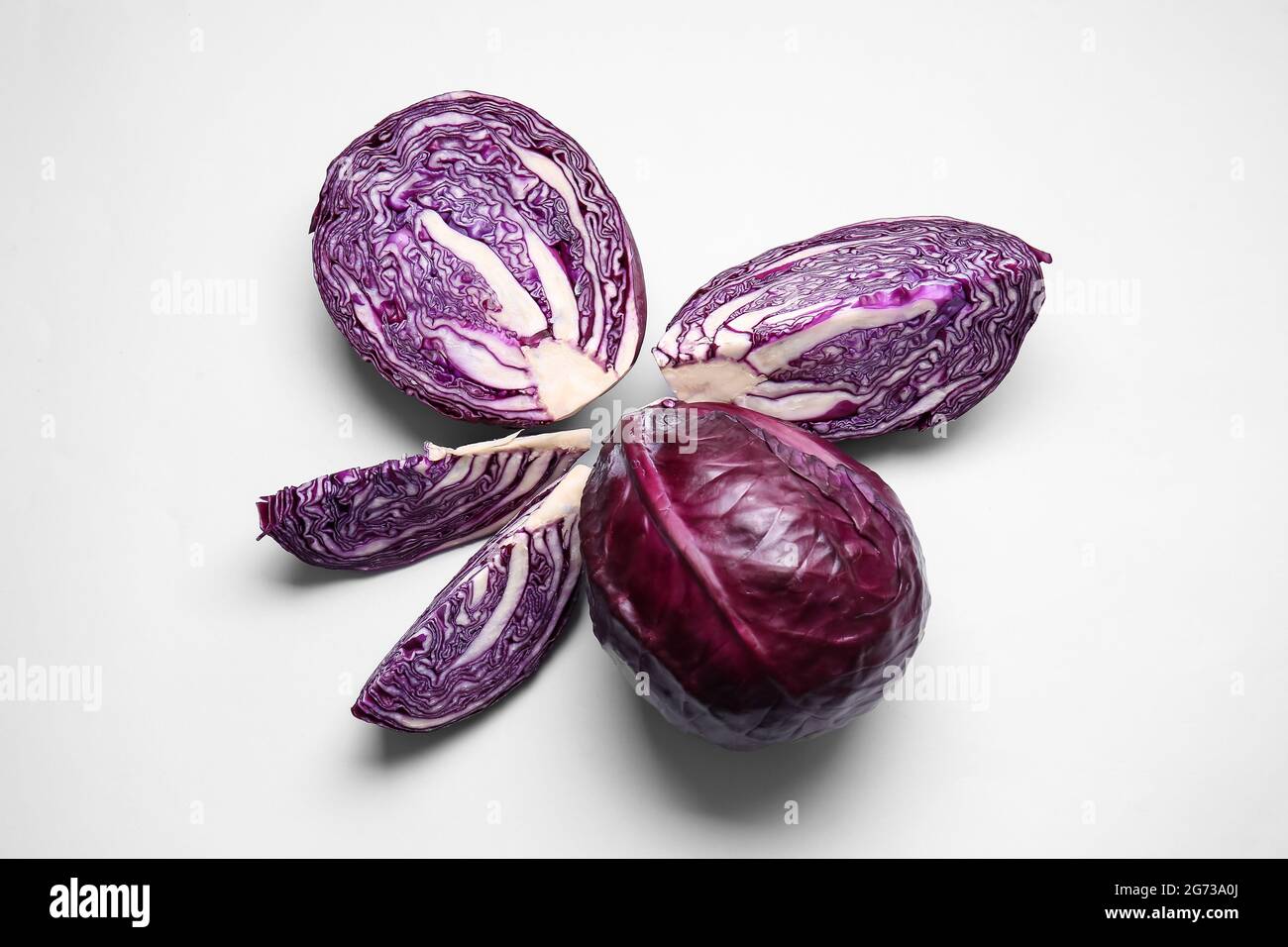 Pieces of fresh purple cabbage on white background Stock Photo - Alamy