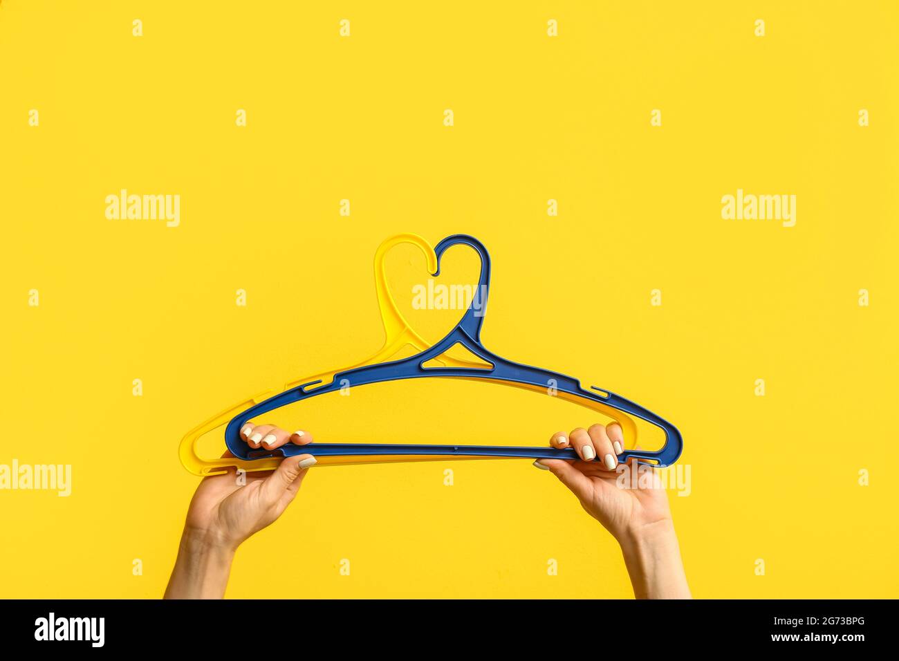 Clothing on hangers female hands hi-res stock photography and images ...