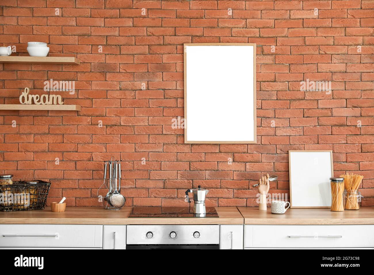 Interior of modern kitchen with blank photo frames Stock Photo - Alamy