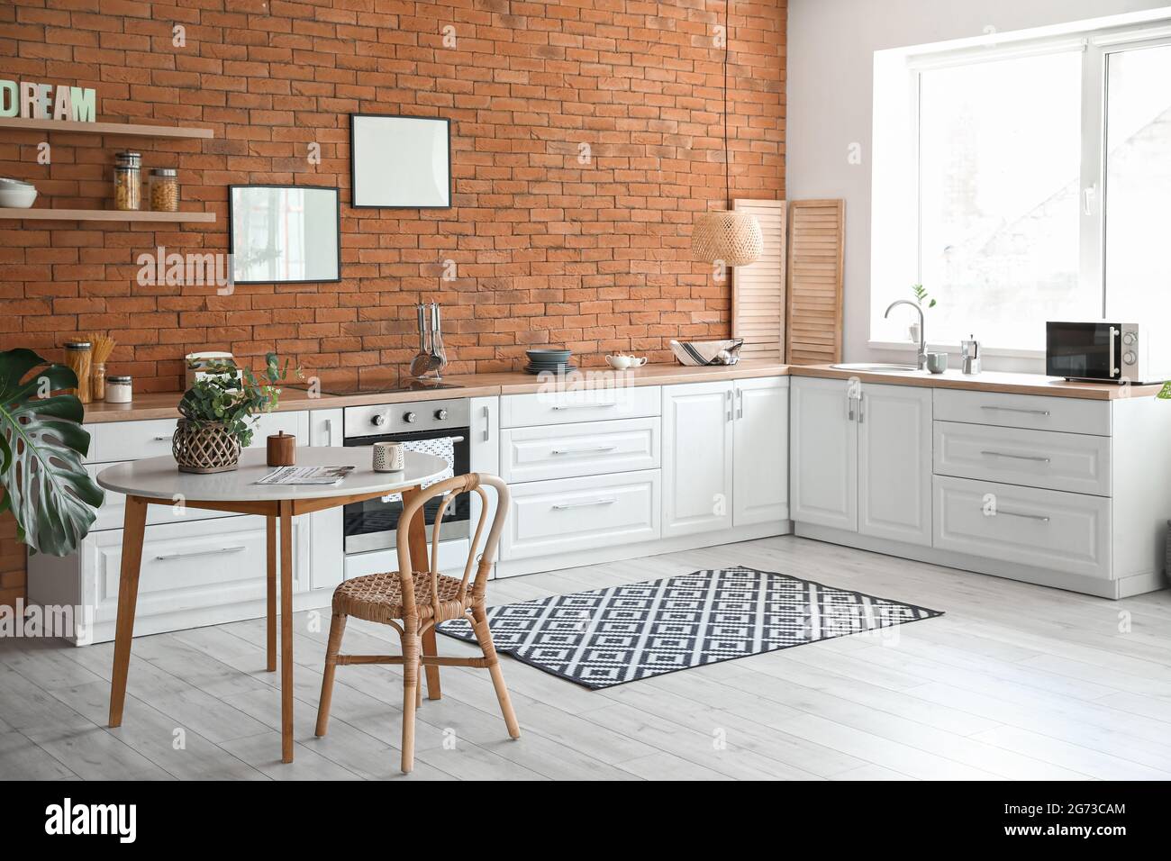 Interior of modern kitchen with blank photo frames Stock Photo - Alamy