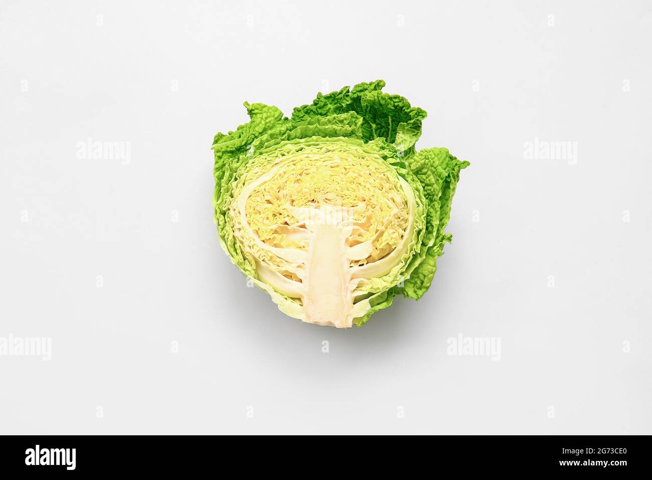 Half of fresh savoy cabbage on white background Stock Photo - Alamy