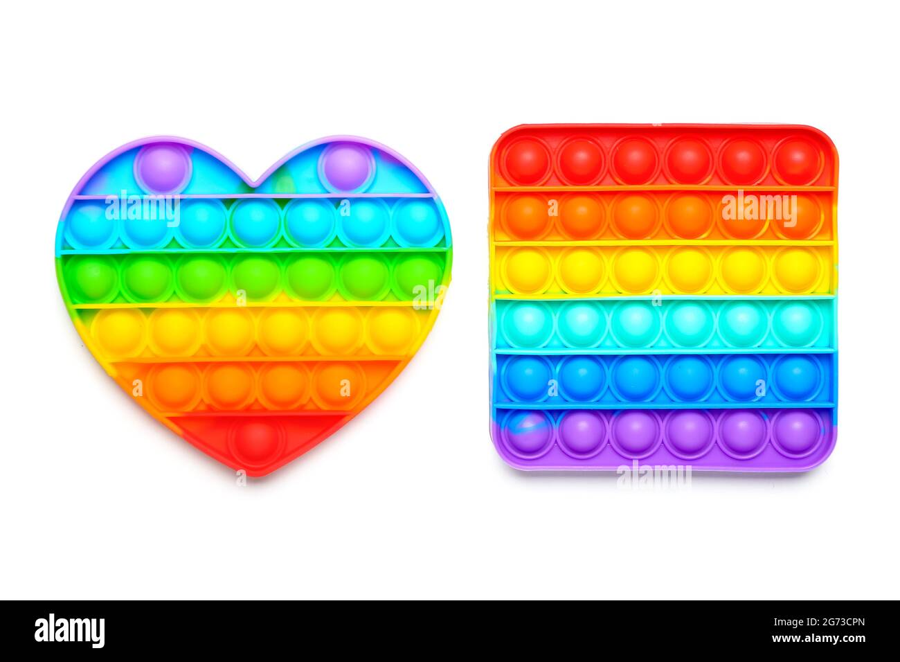 Bright fidget toys on white background Stock Photo - Alamy