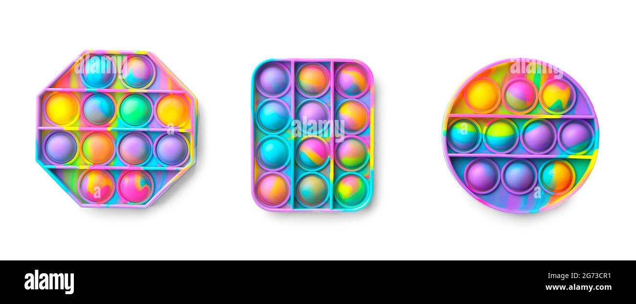 Bright fidget toys on white background Stock Photo - Alamy