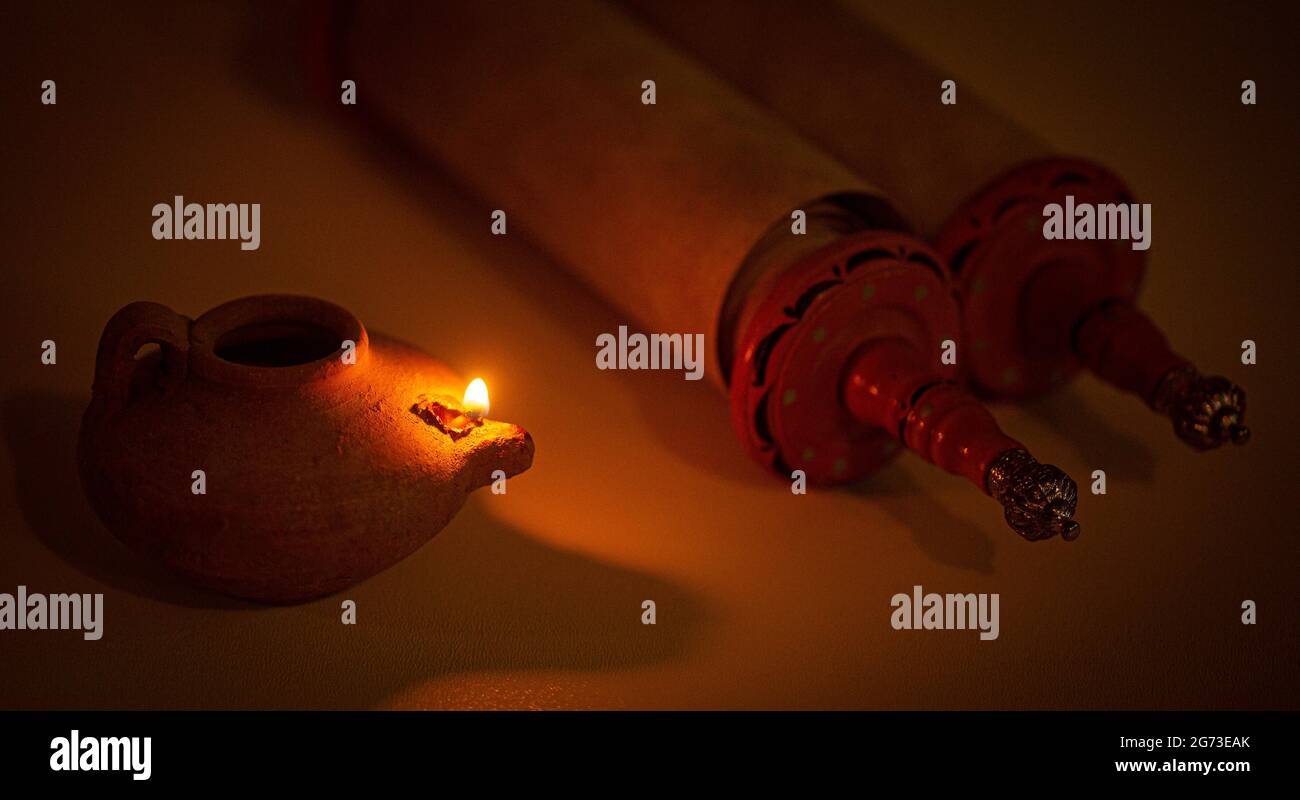 An Ancient Lamp Illuminating the Hebrew Text of the Torah Stock Photo ...