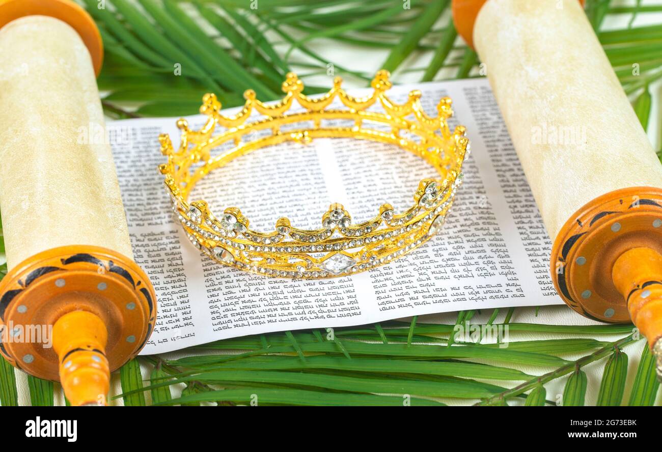A Scroll and Royal Crown on a Bed of Palm Branches Stock Photo - Alamy