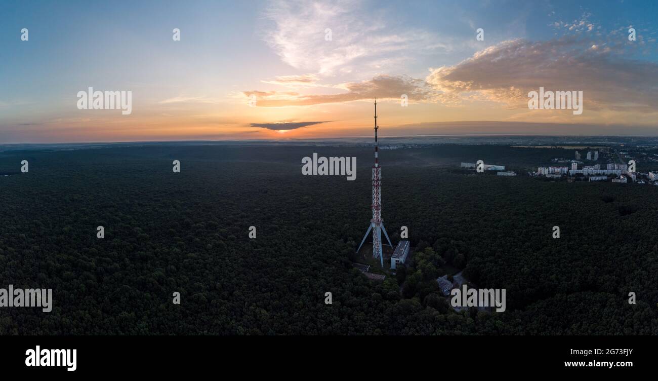 Aerial sunrise summer panoramic view on forest with telecommunication ...