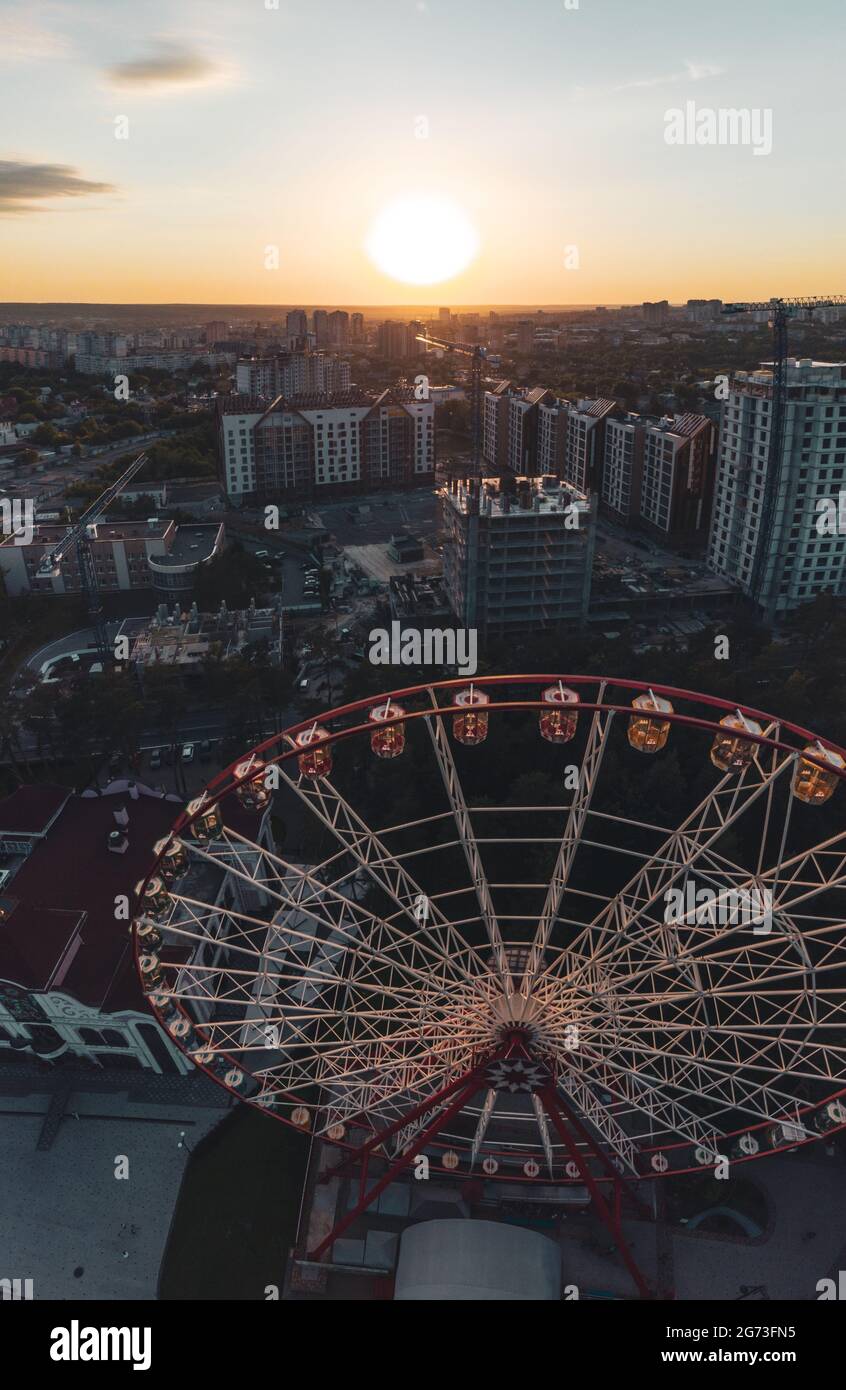Ferris wheel vertical aerial sunset view in Kharkiv city center ...