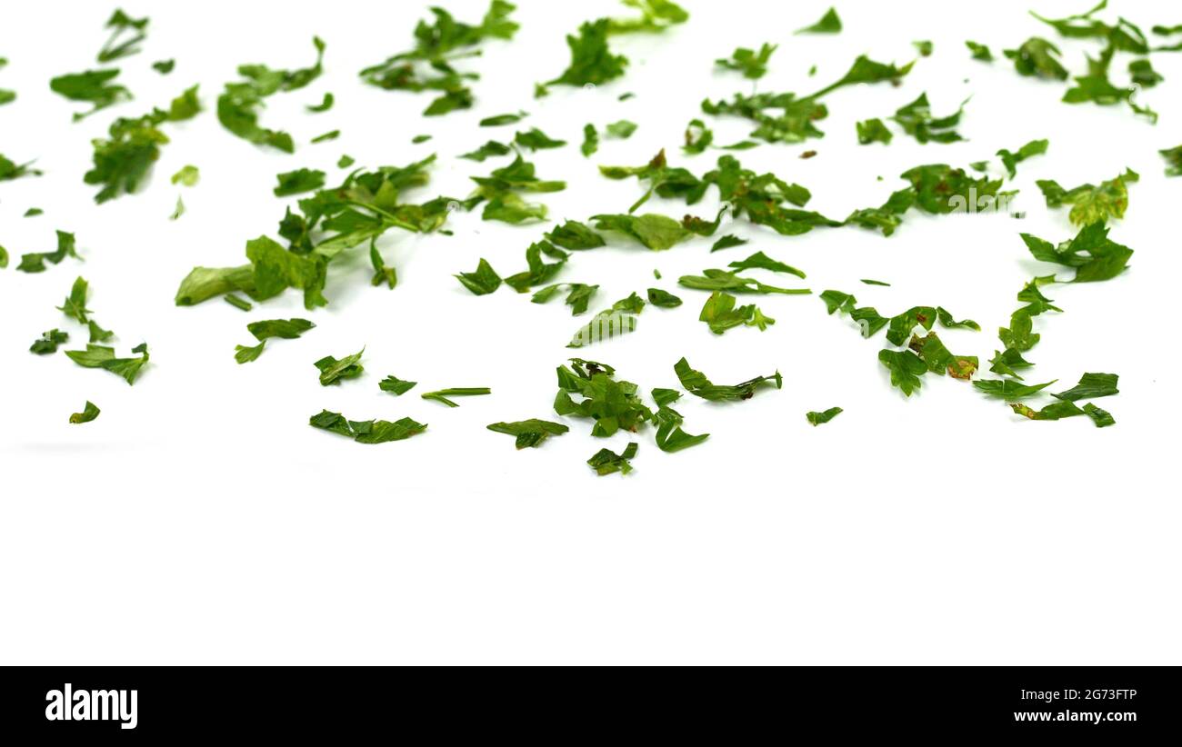 Fresh green chopped parsley leaves isolated on white background and ...