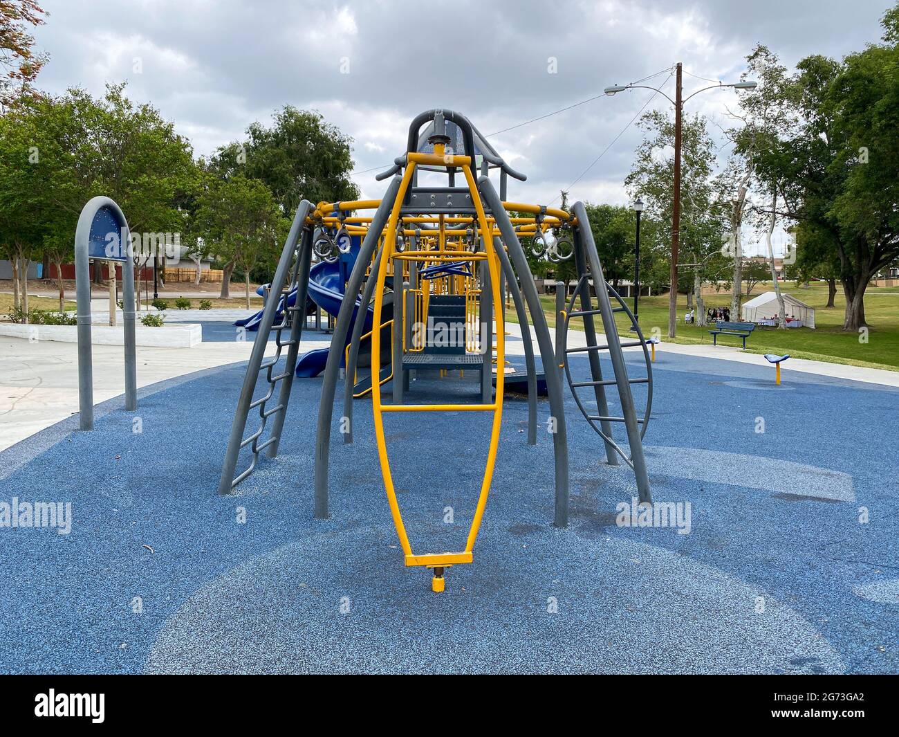 Slide, swing on modern playground. Children playground activities in ...