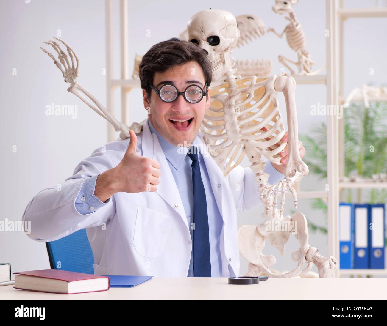 The crazy professor studying human skeleton Stock Photo - Alamy