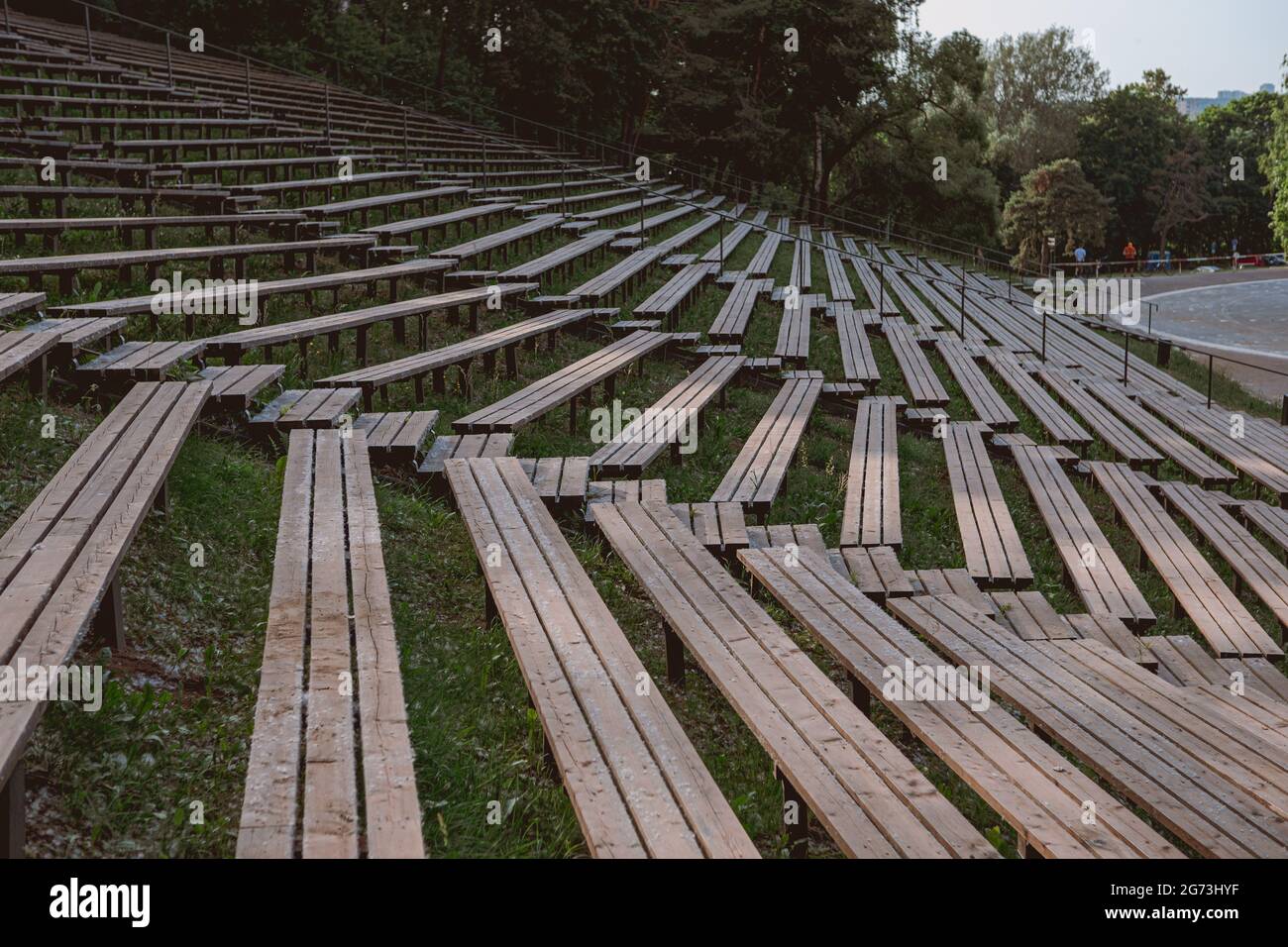Empty wooden benches of the stadium Stock Photo - Alamy