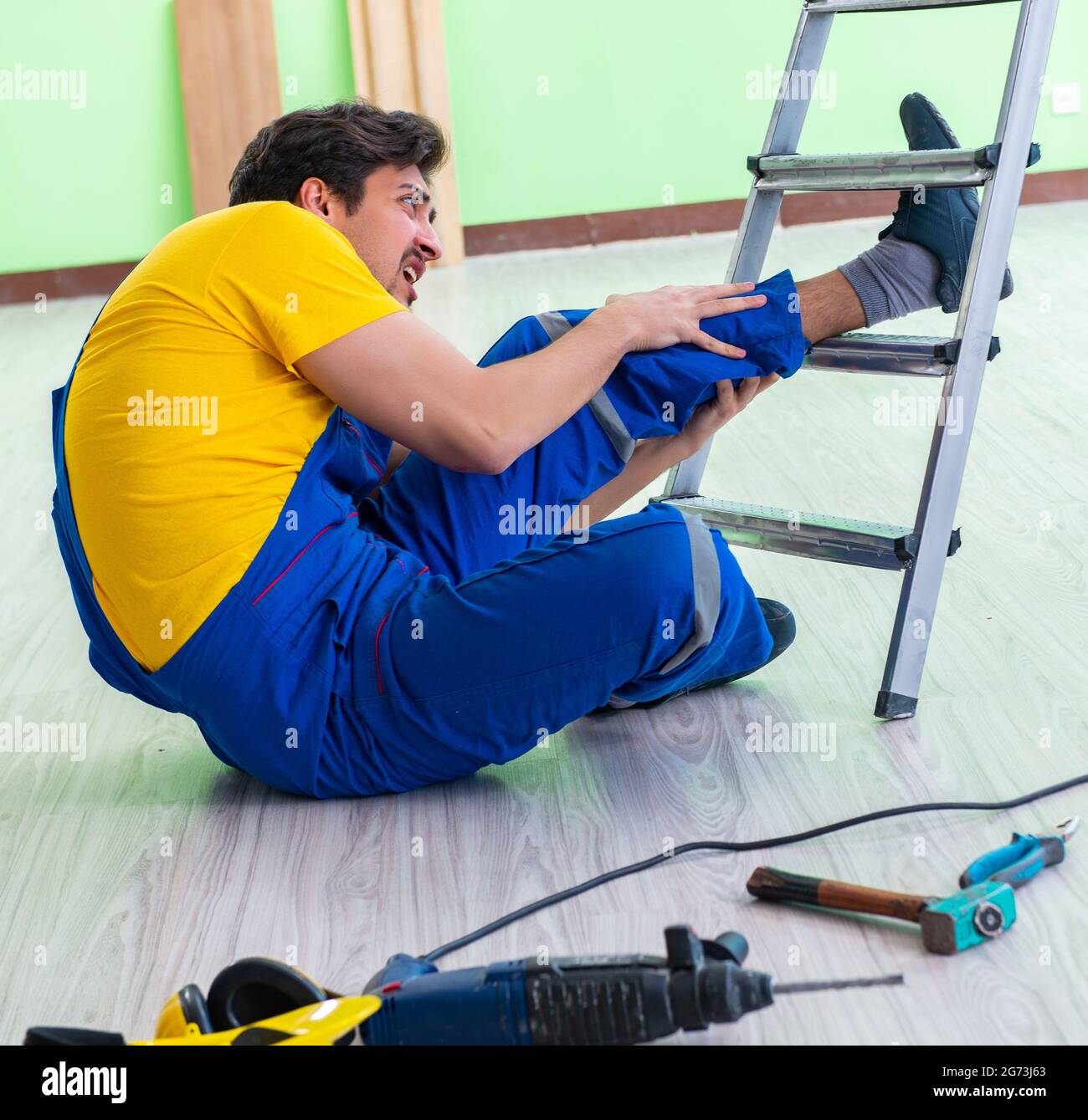 The injured worker at the work site Stock Photo - Alamy