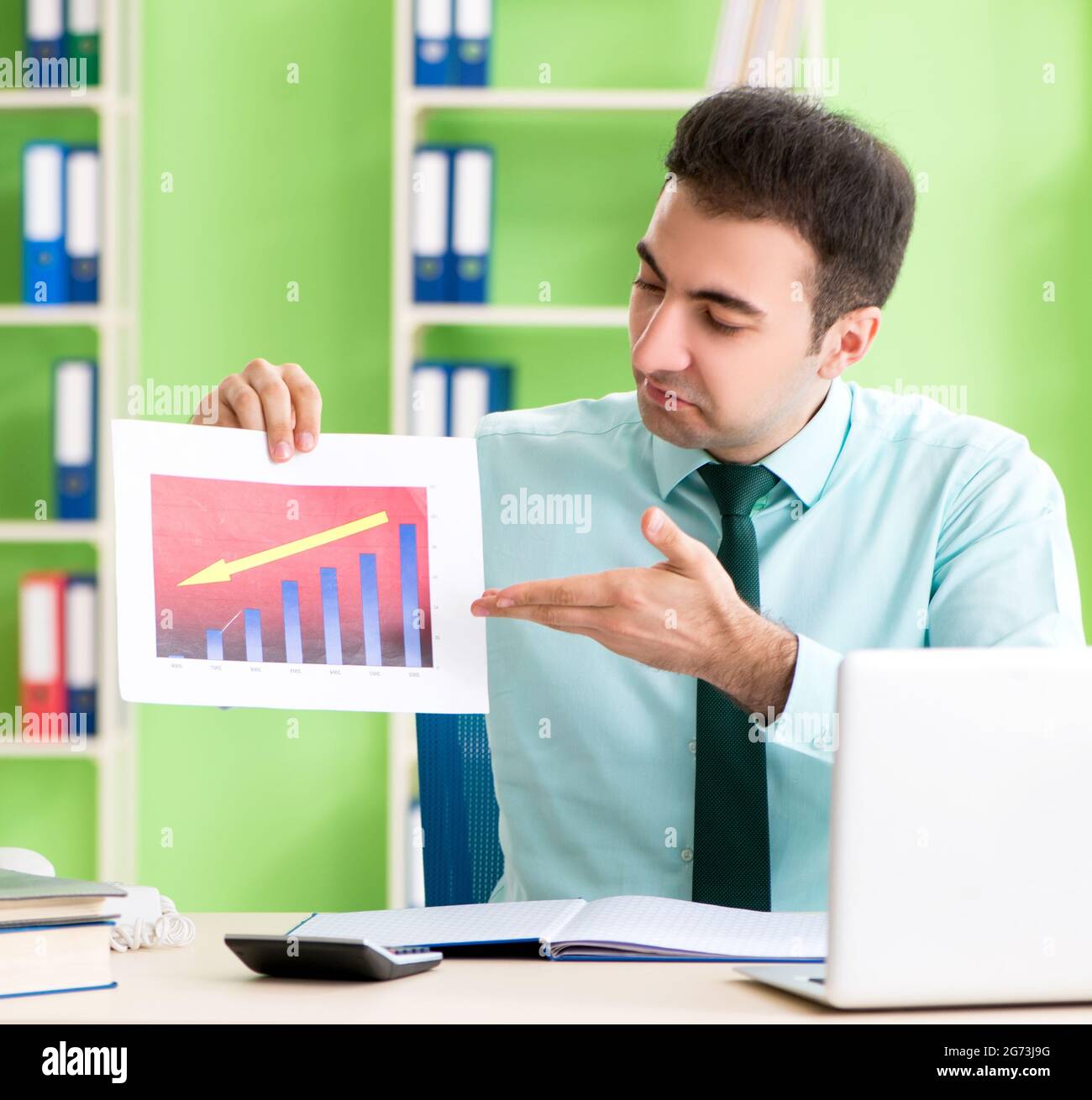 The male financial manager working in the office Stock Photo - Alamy