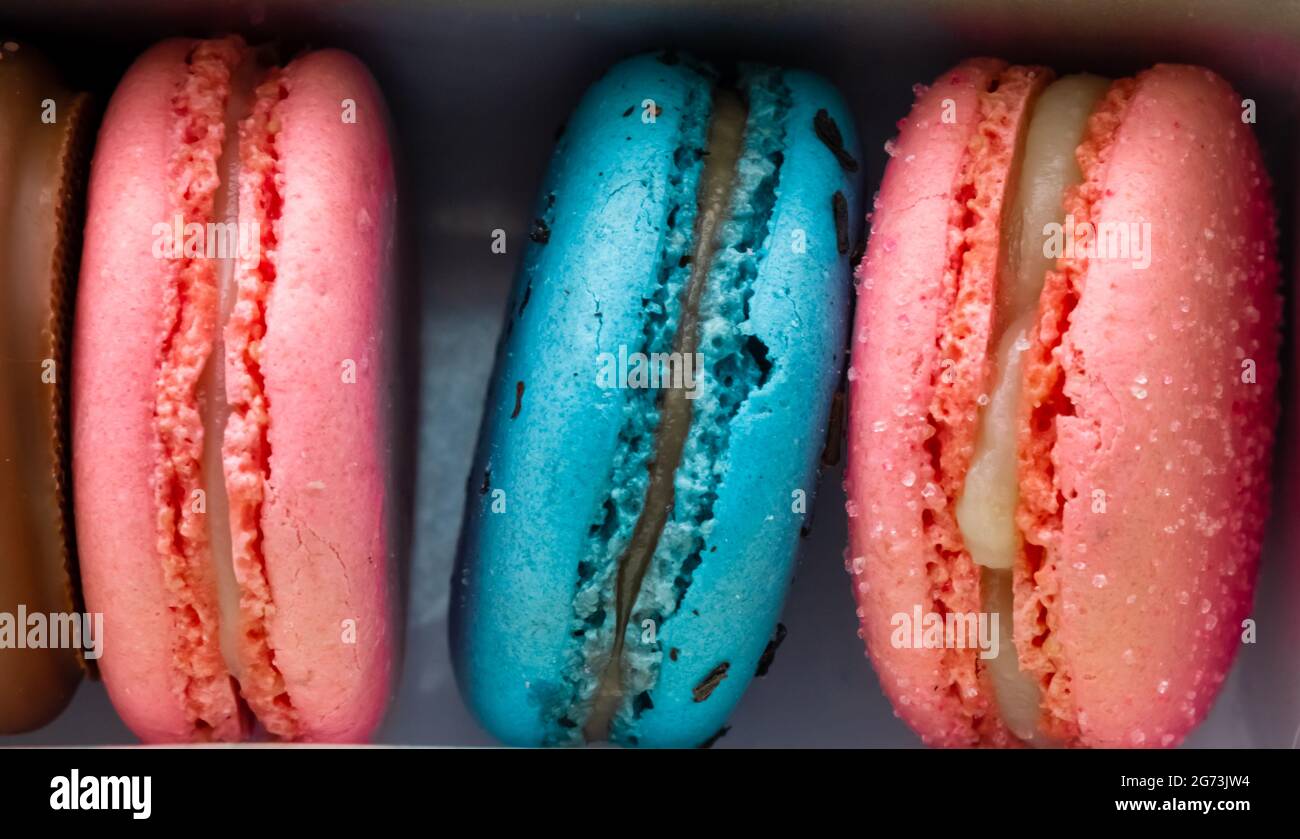 Colored macaroons close up. Close up colored macaron, three french ...