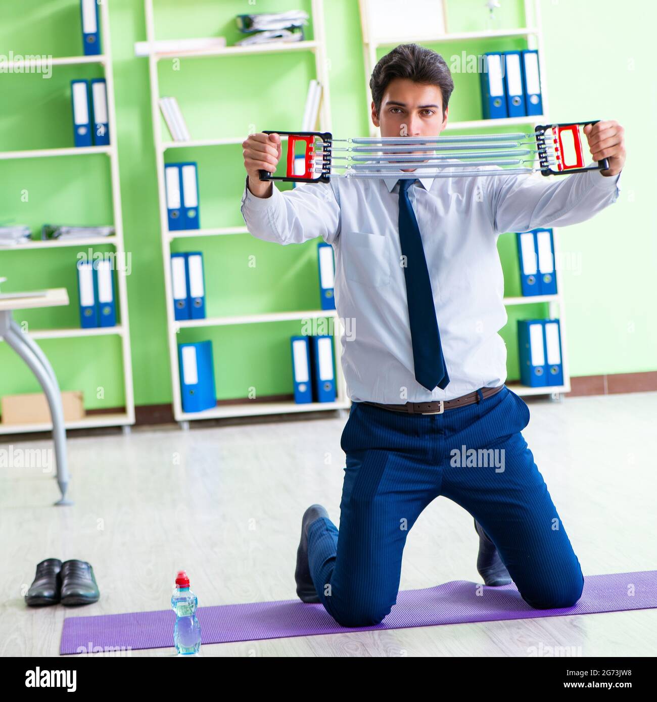 The employee doing exercises during break at work Stock Photo - Alamy