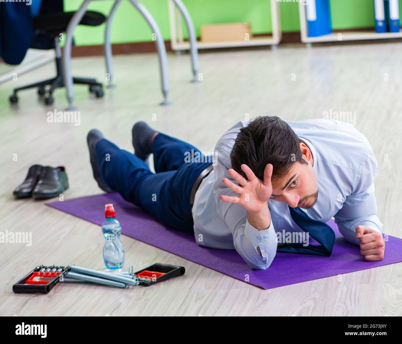 The employee doing exercises during break at work Stock Photo - Alamy