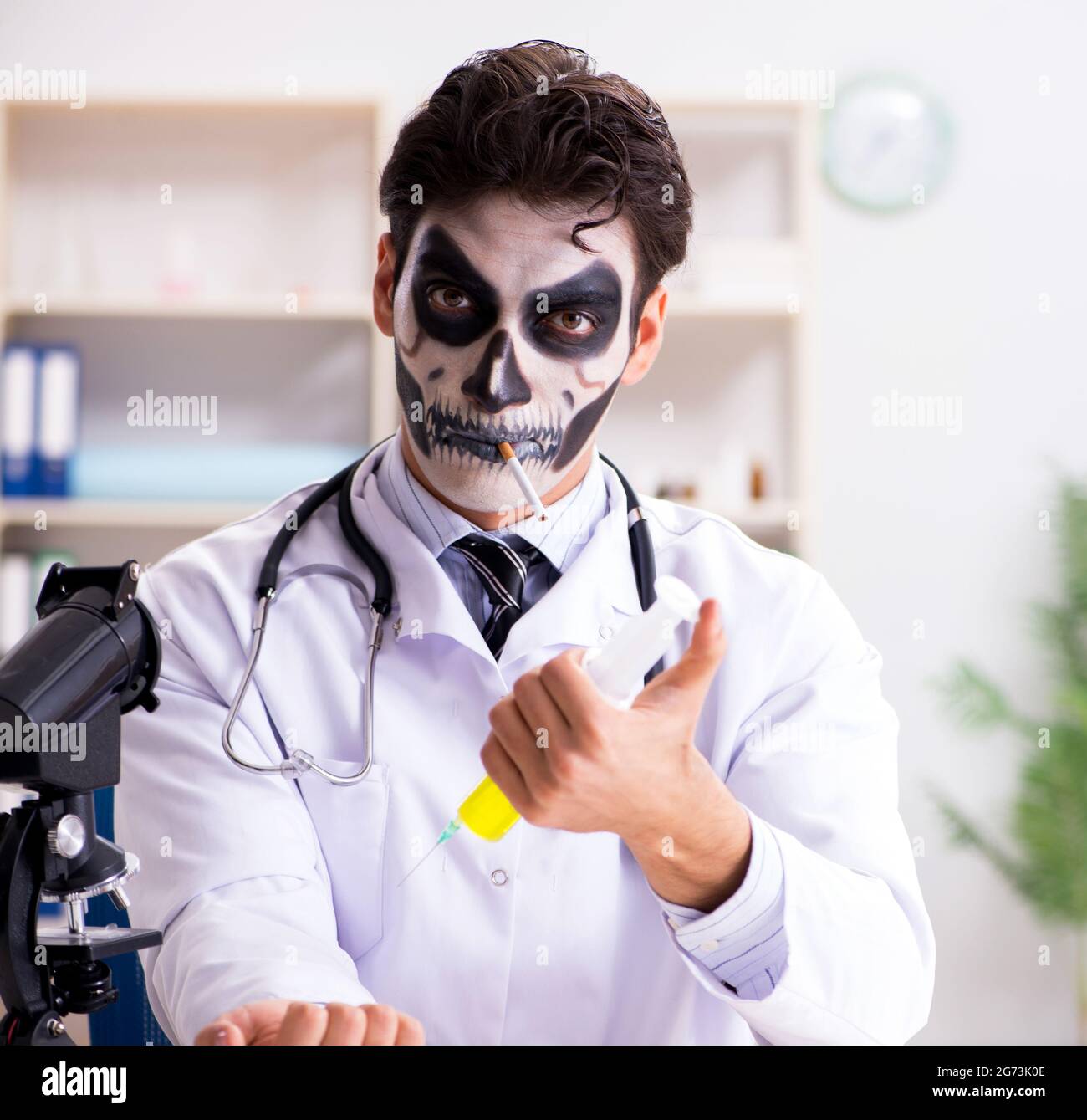 The scary monster doctor working in lab Stock Photo - Alamy