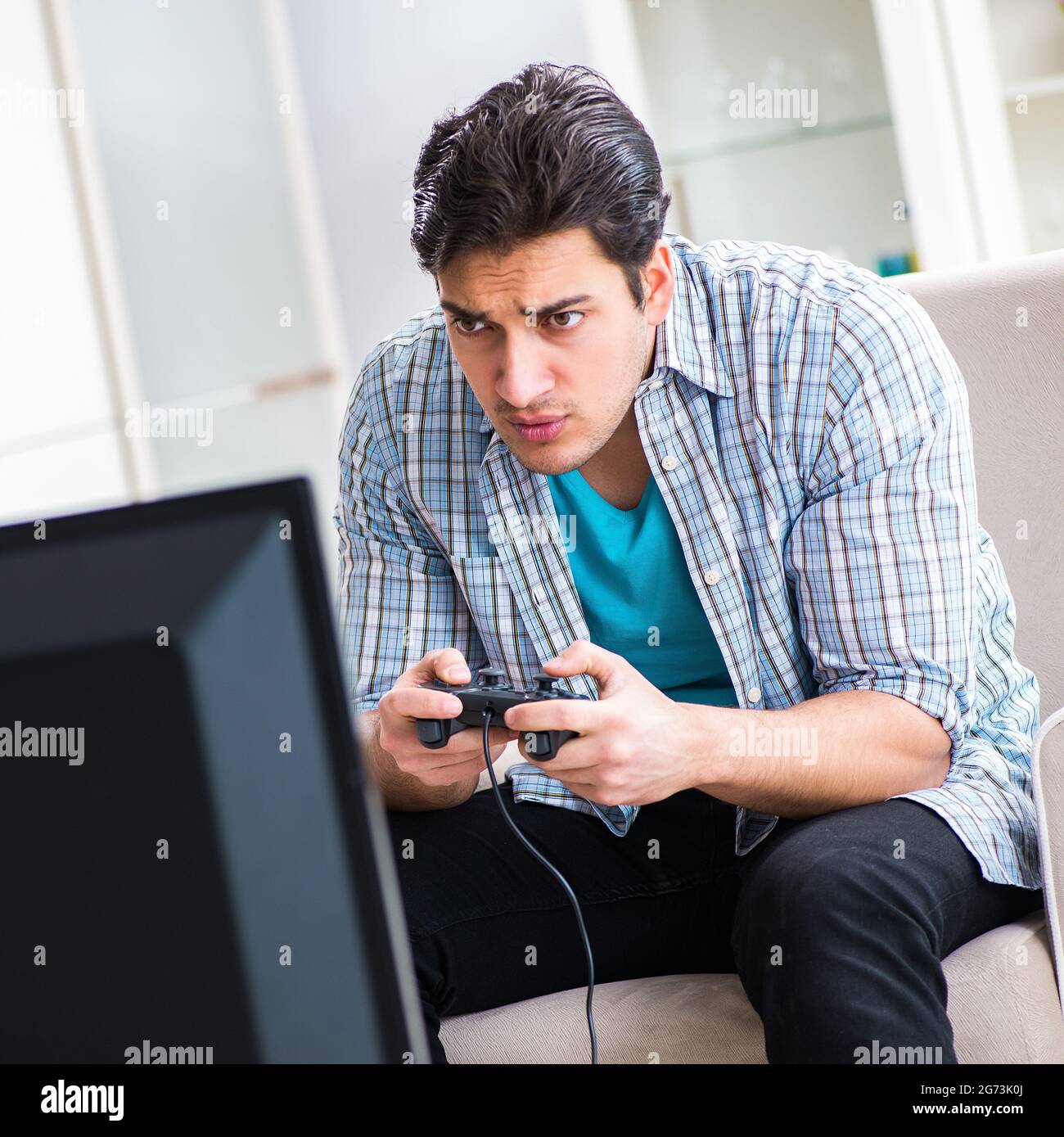 The man playing computer game at home Stock Photo - Alamy