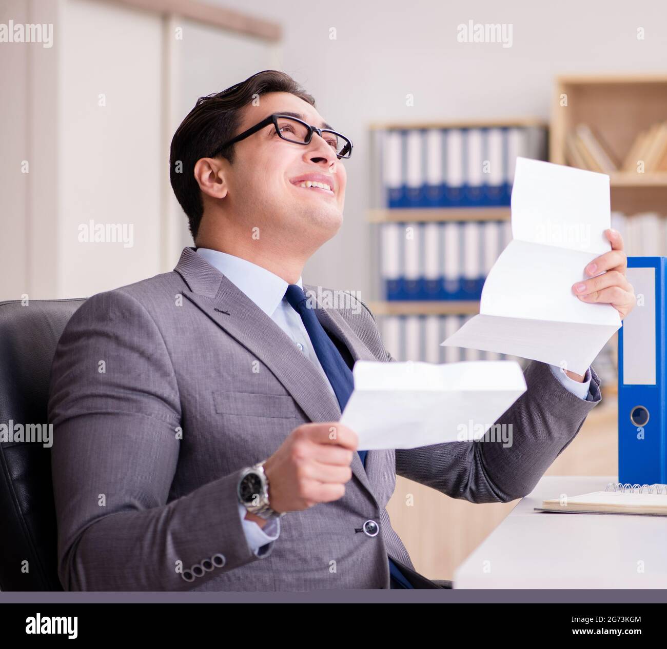The businessman receiving letter in the office Stock Photo - Alamy