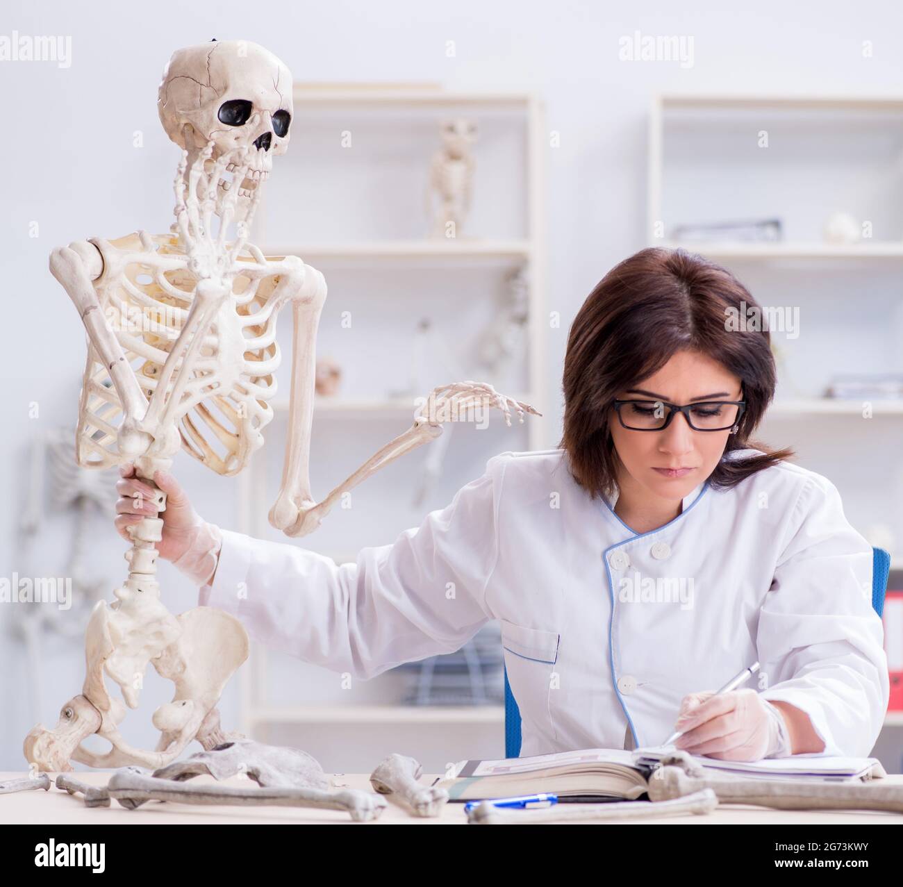 The doctor working in the lab on skeleton Stock Photo - Alamy