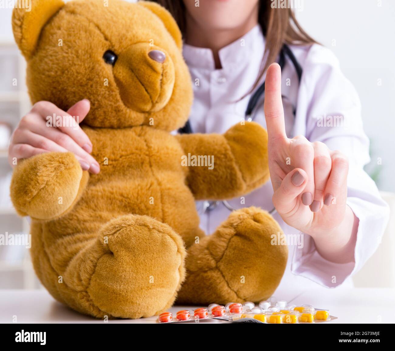 The child checking soft toy health Stock Photo - Alamy