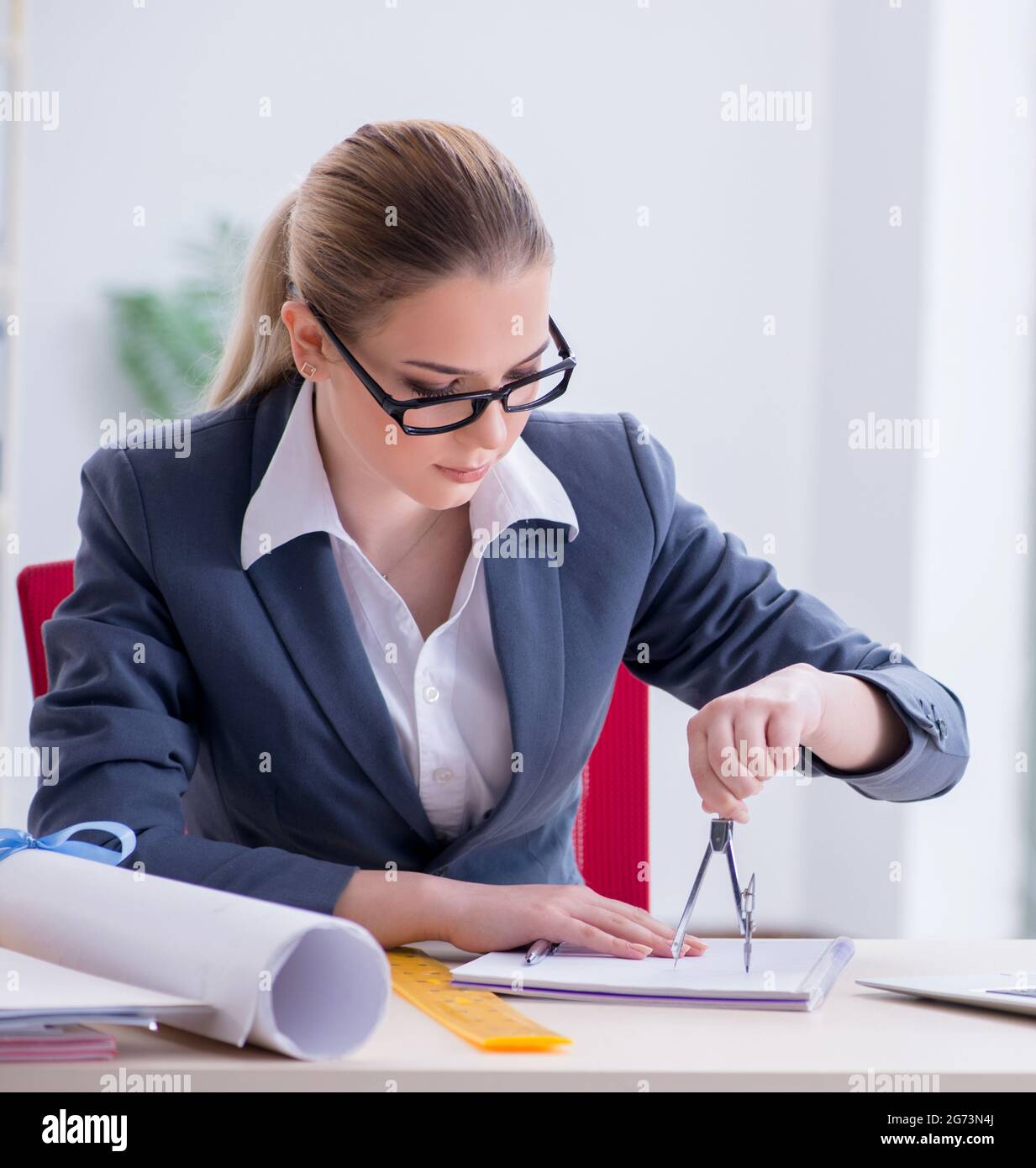 The woman architect working on the project Stock Photo - Alamy