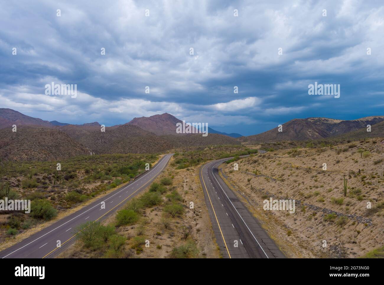 Panoramic aerial view highway across the arid desert Arizona mountains ...